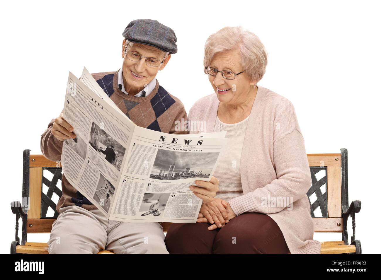 Elderly man and woman reading a newspaper together isolated on white ...