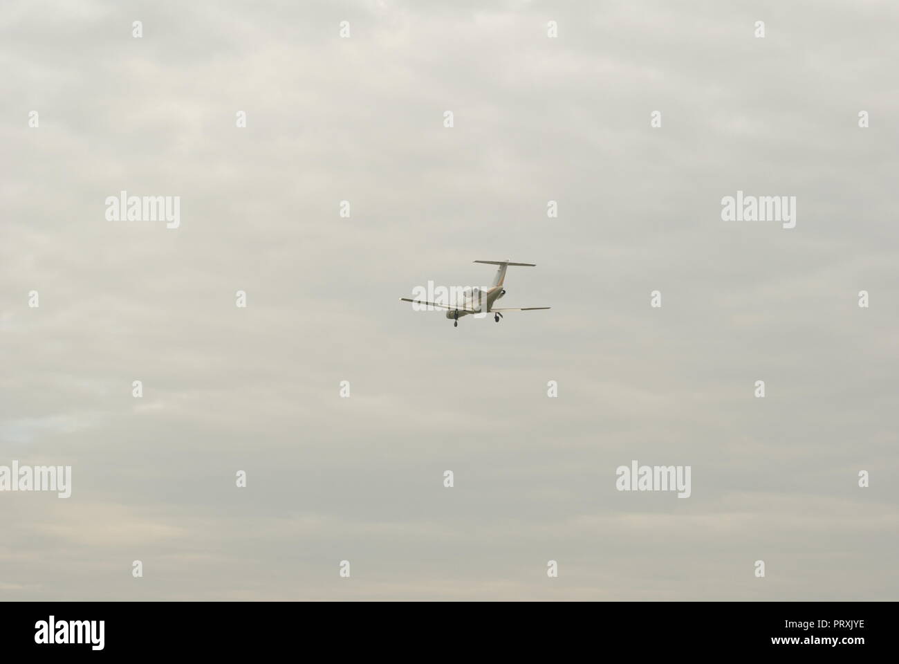 Airplane landing while bad weather in Bremen business jet airplane with ...