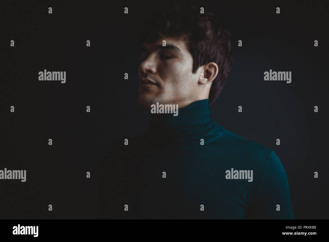 Dramatic portraits series with a young man on dark background Stock ...