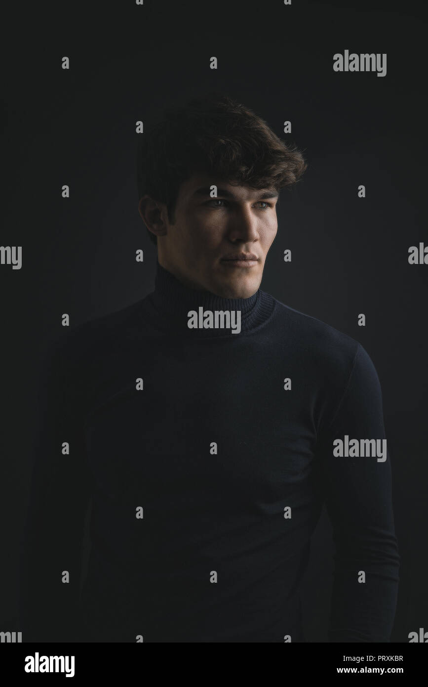 Dramatic portraits series with a young man on dark background Stock ...