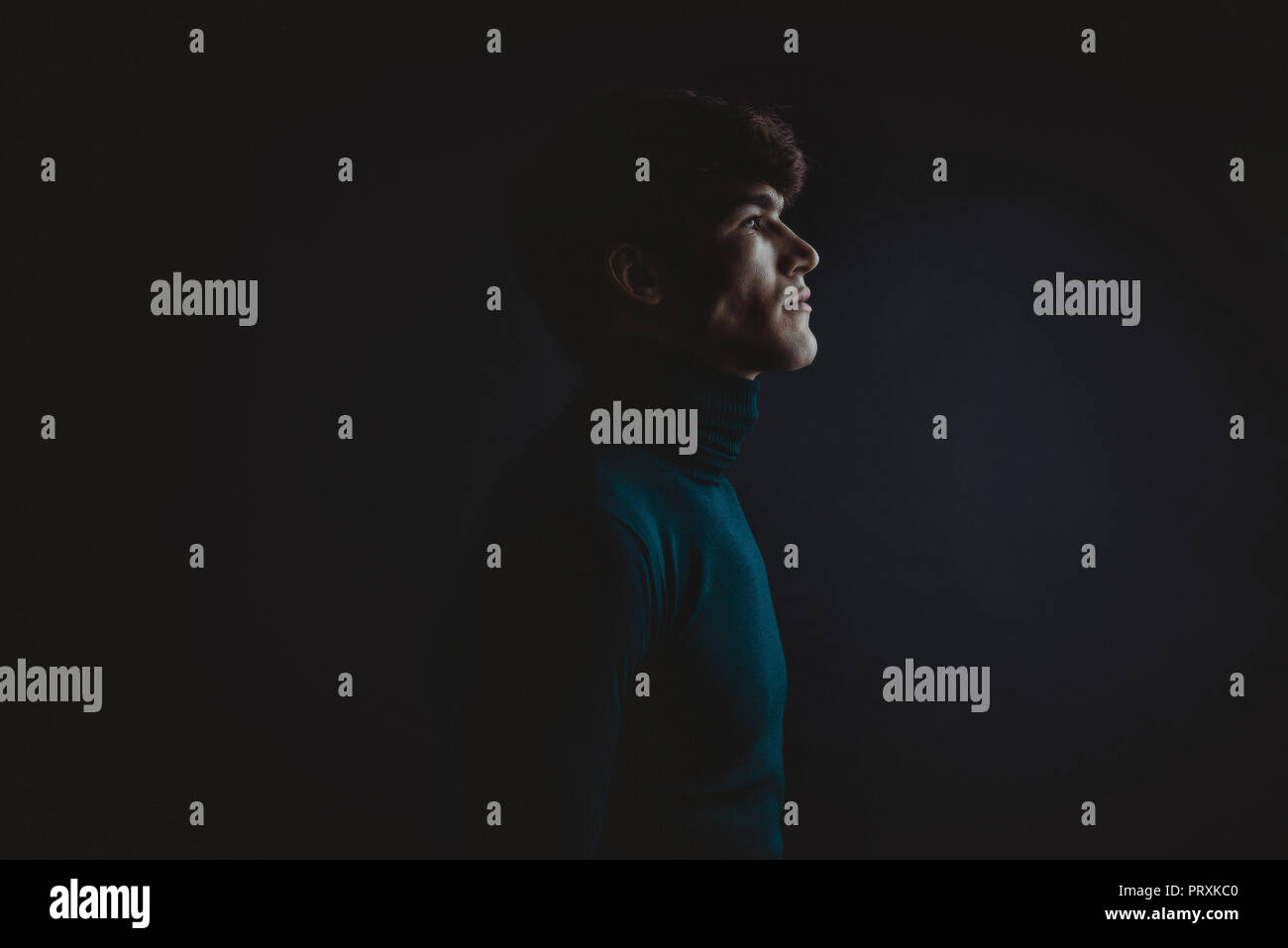 Dramatic portraits series with a young man on dark background Stock ...