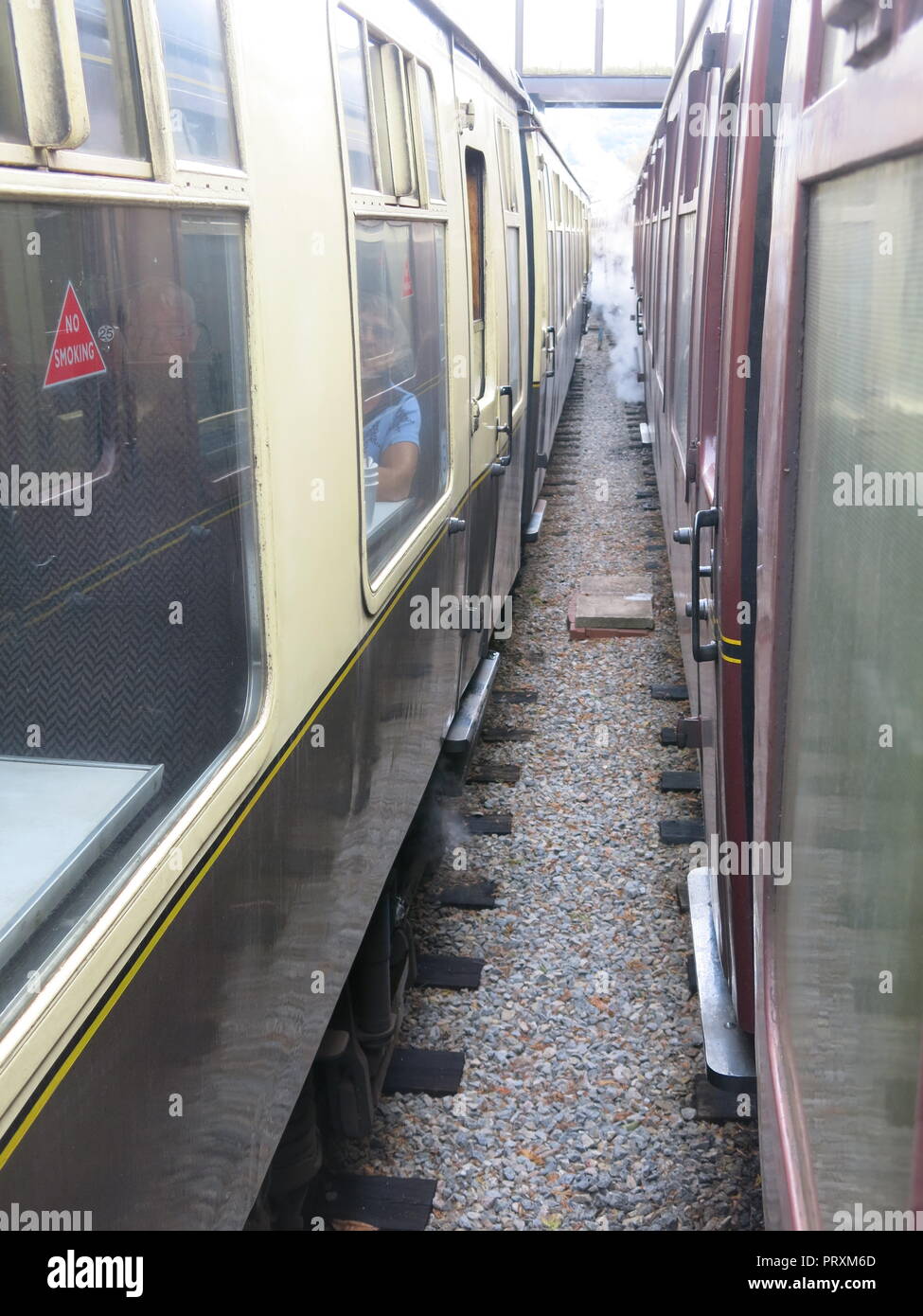 There's a narrow gap between the carriages when two steam trains pass each other on the tracks ...
