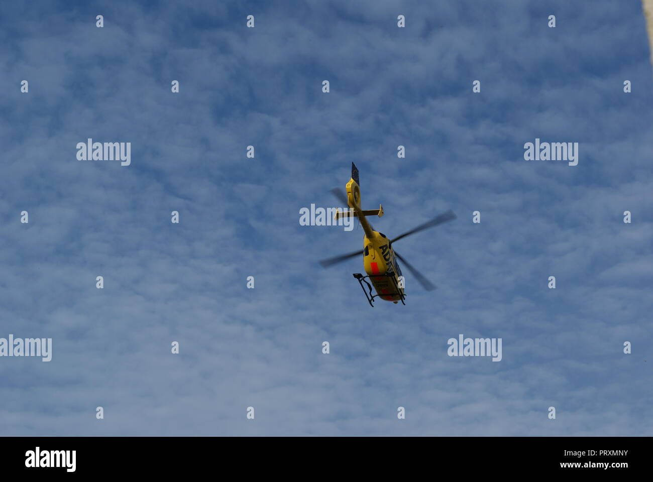 Helicopter start in blue sky with clouds emergency call helicopter ...