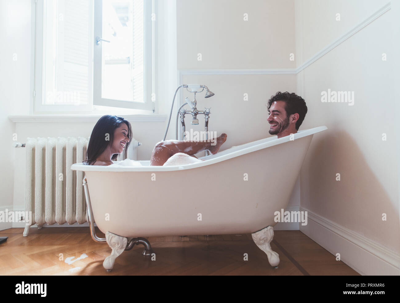 Couple in love spending time together in the house. Romantic moments in ...