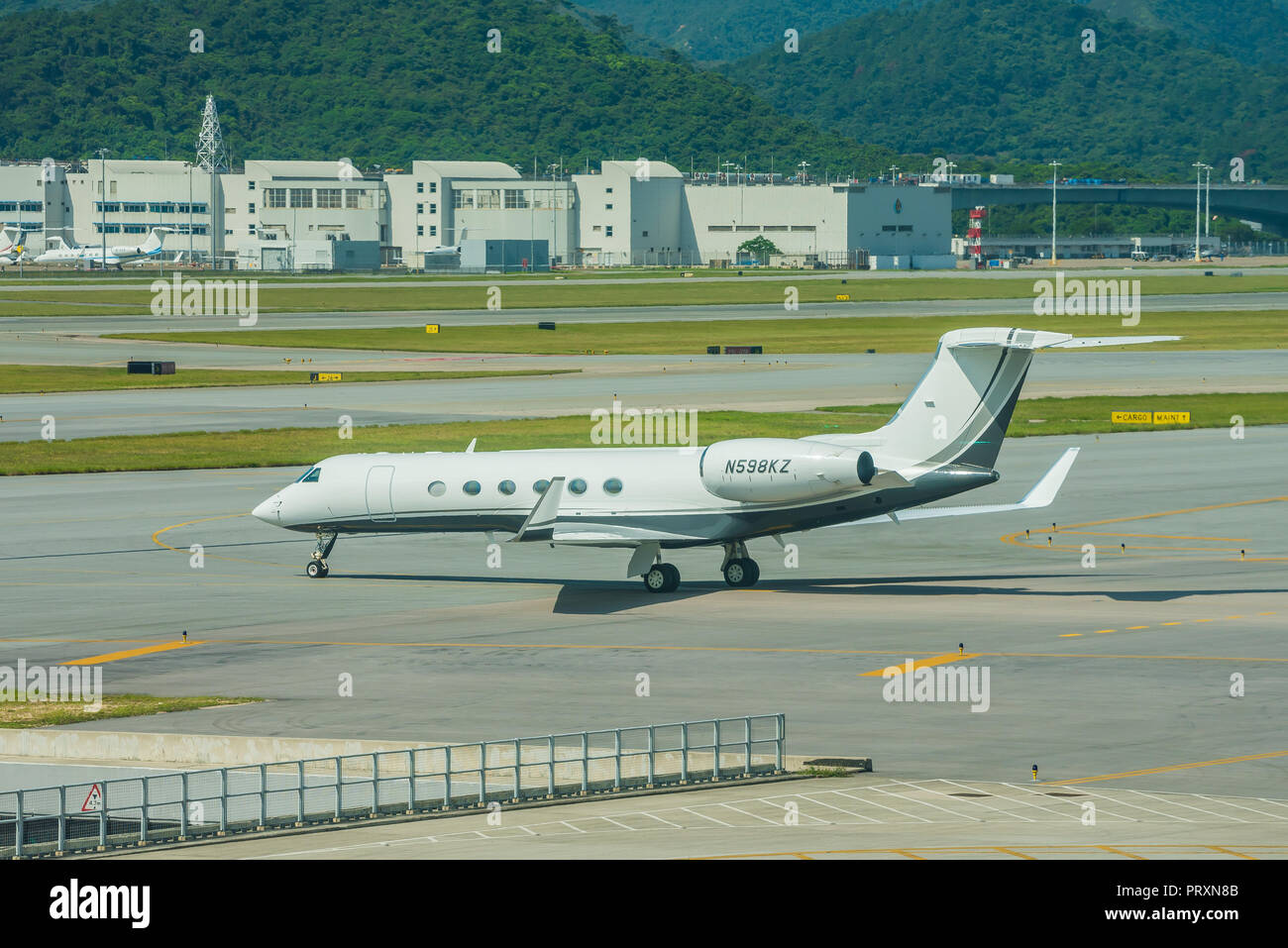 HONG KONG AIRPORT, CHINA - AUG. 6,2017 : A private jet plane is taxiing ...