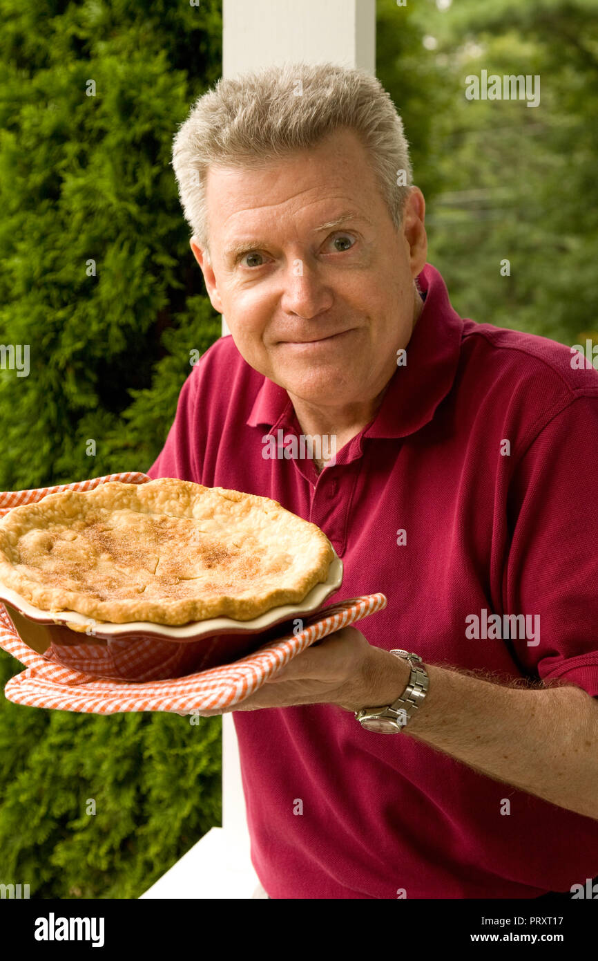 Senior man shows off his freshly baked pie, USA Stock Photo - Alamy
