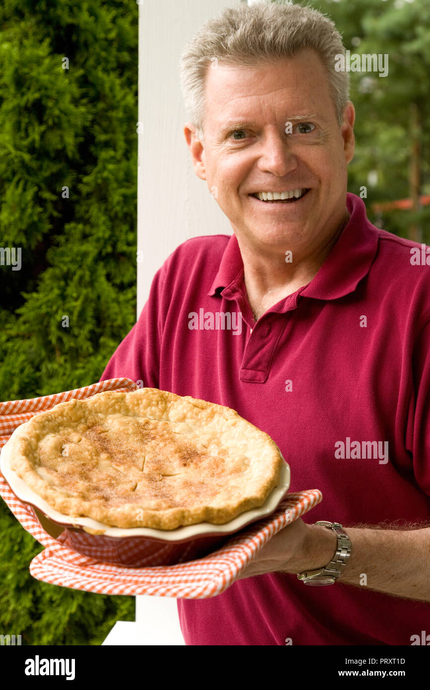 Senior man shows off his freshly baked pie, USA Stock Photo - Alamy