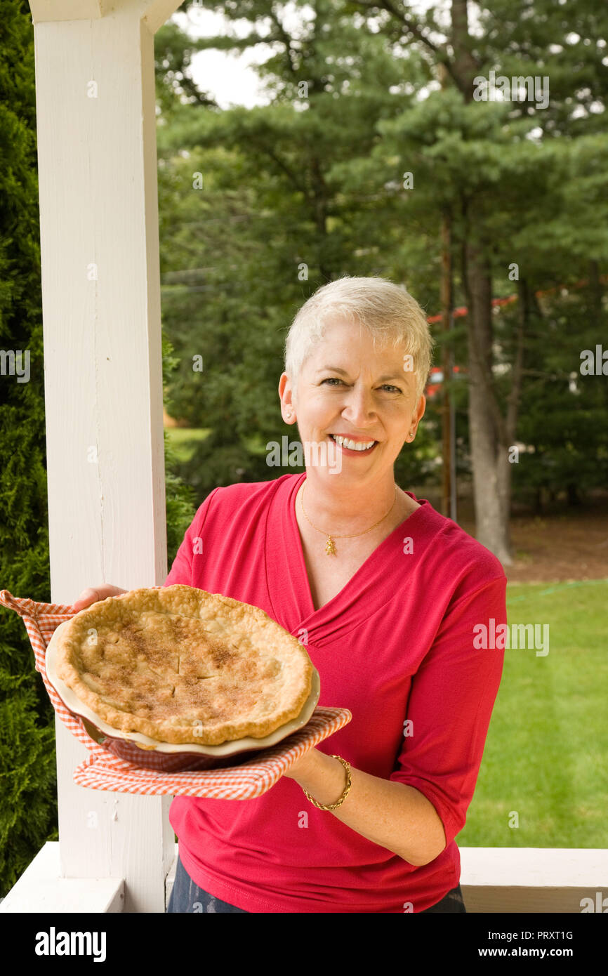 Senior woman shows off her freshly baked pie, USA Stock Photo - Alamy