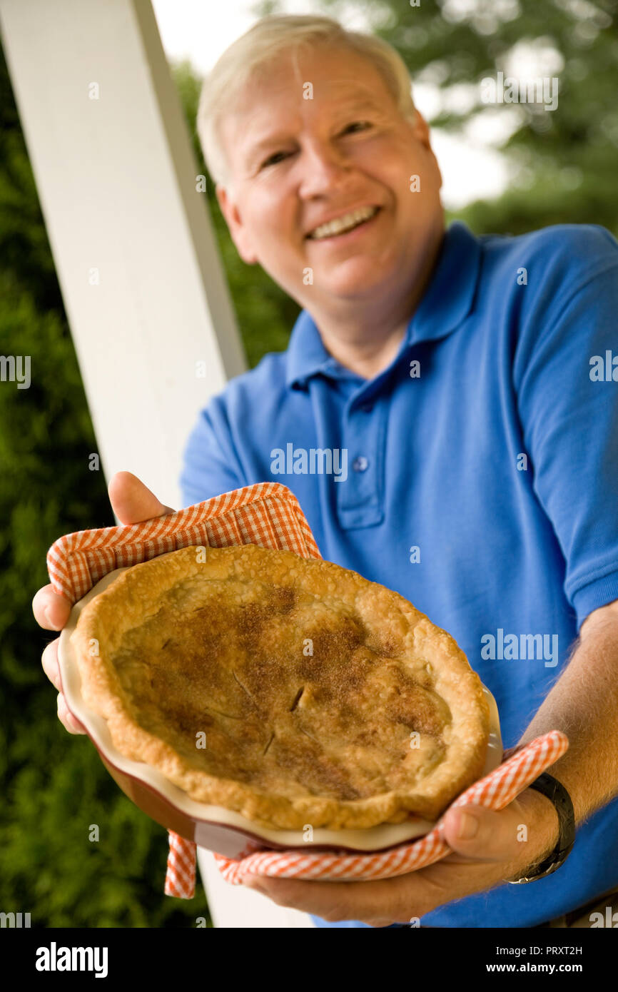 Senior man shows off his freshly baked pie, USA Stock Photo - Alamy