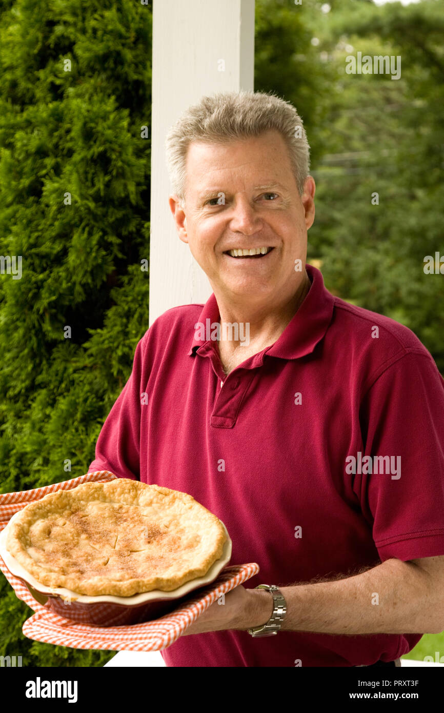 Senior man shows off his freshly baked pie, USA Stock Photo - Alamy