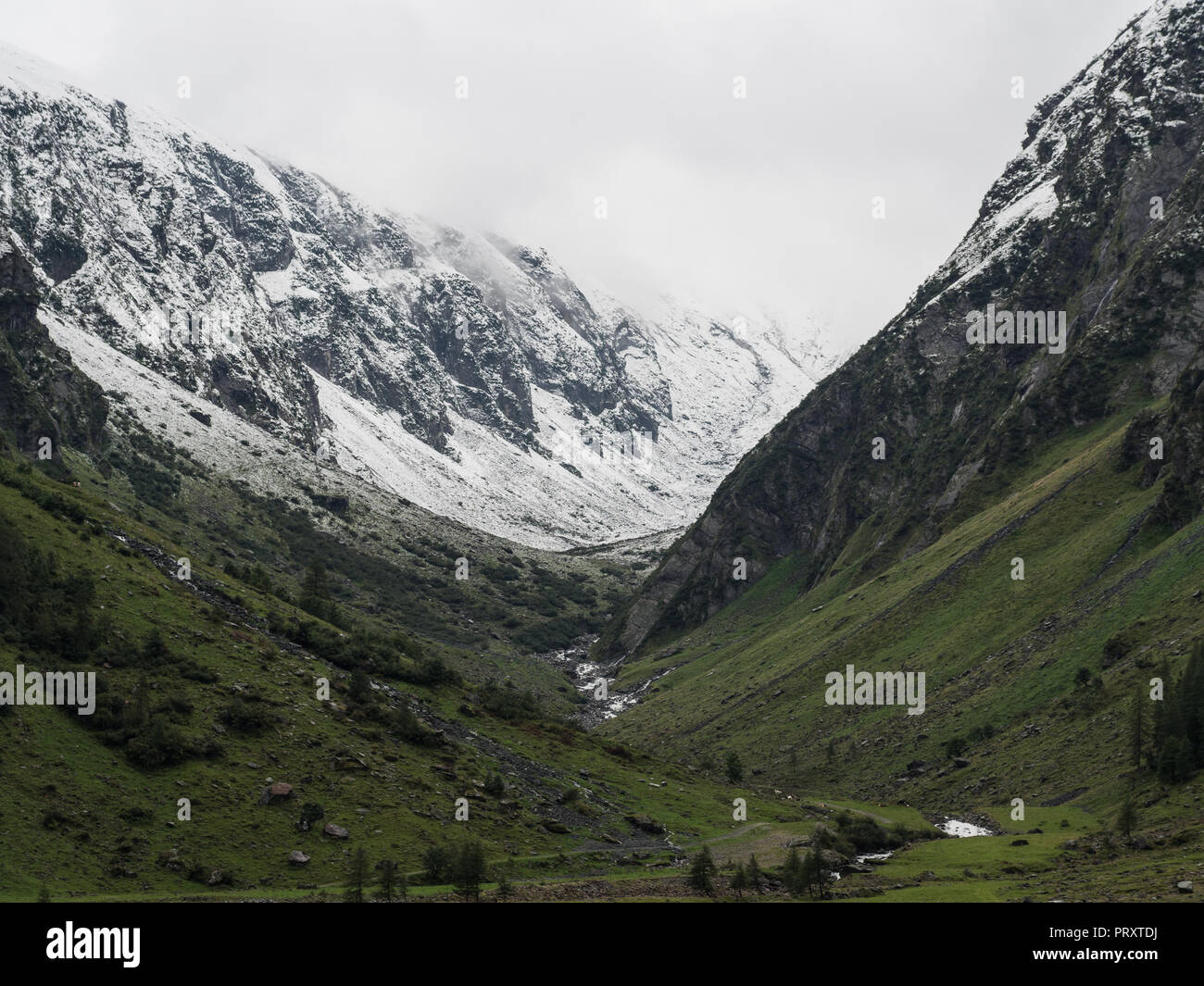 Snow capped mountains valley view Stock Photo - Alamy