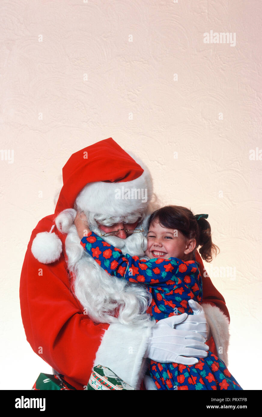 Cute four year old girl visits Santa Claus, USA Stock Photo - Alamy