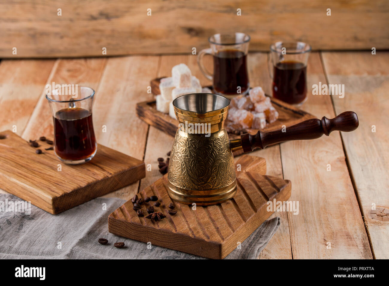 Coffee turk and cup of coffee on wooden background. turkish coffee into ...