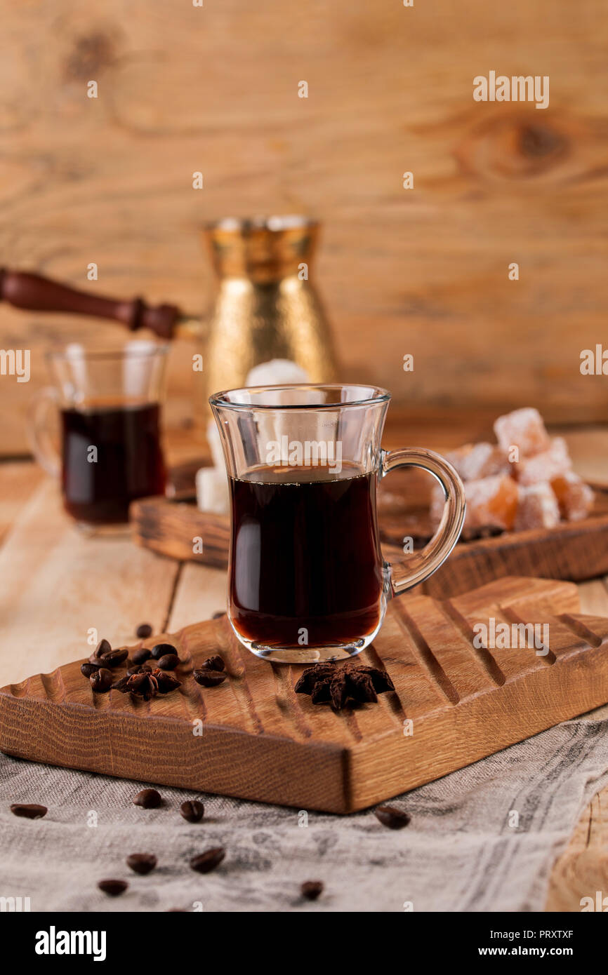 Turk of flavored coffee on table with napkin, closeup. turkish coffee ...