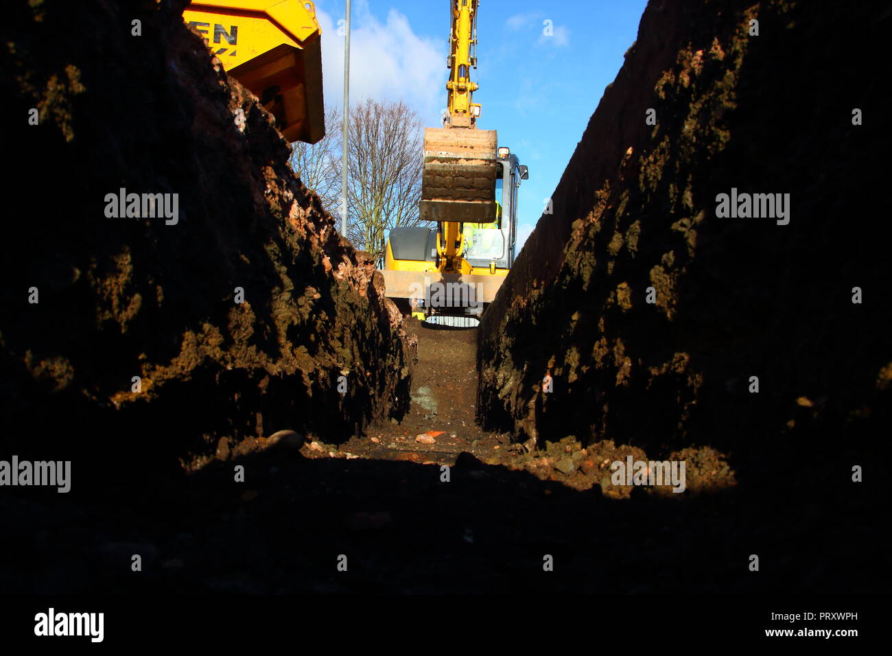 What the view from the bottom of a ditch looks like as workers dig out ...