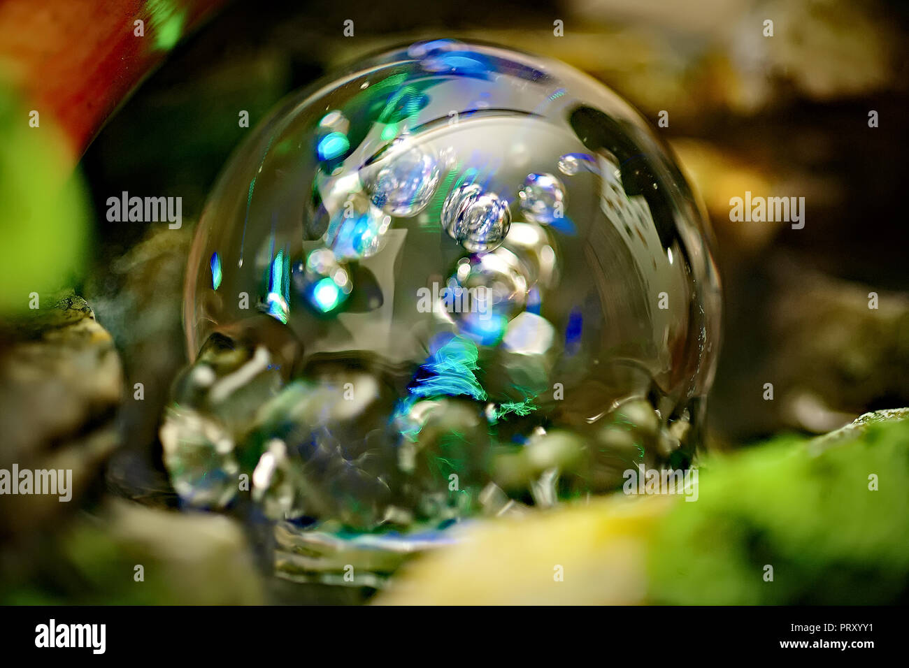 sparkling ball in water. holiday, light, green Stock Photo - Alamy
