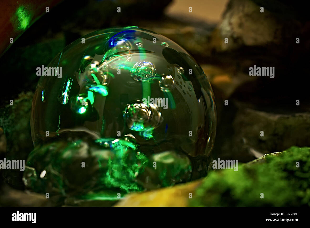 sparkling ball in water. holiday, light, green Stock Photo - Alamy