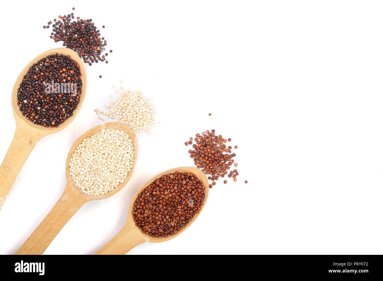 Black red white quinoa seeds in wooden spoon isolated on white ...
