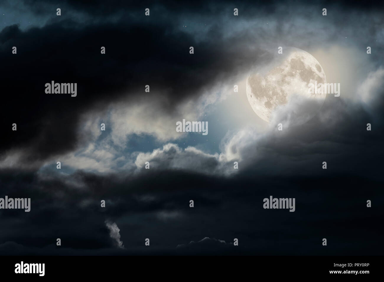Cloudy full moon night sky Stock Photo - Alamy