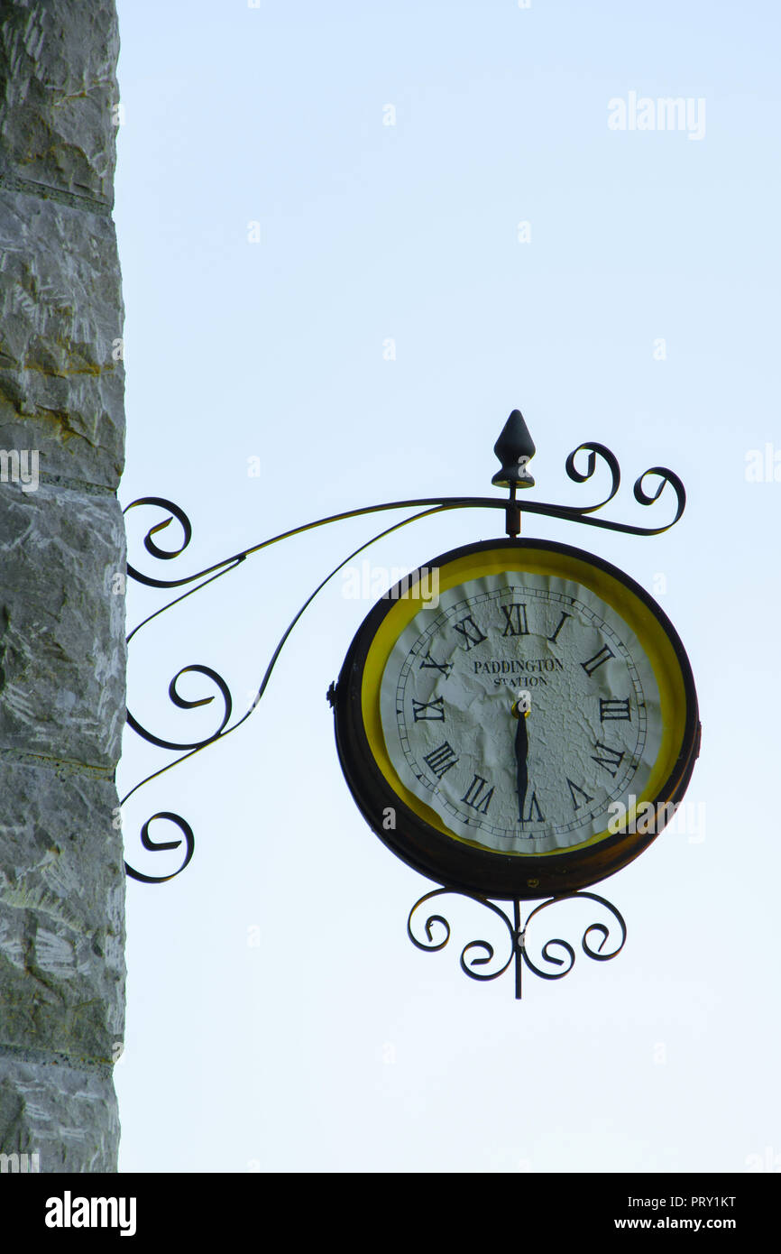 Old fashioned wall clock with "Paddington station" text inside against ...