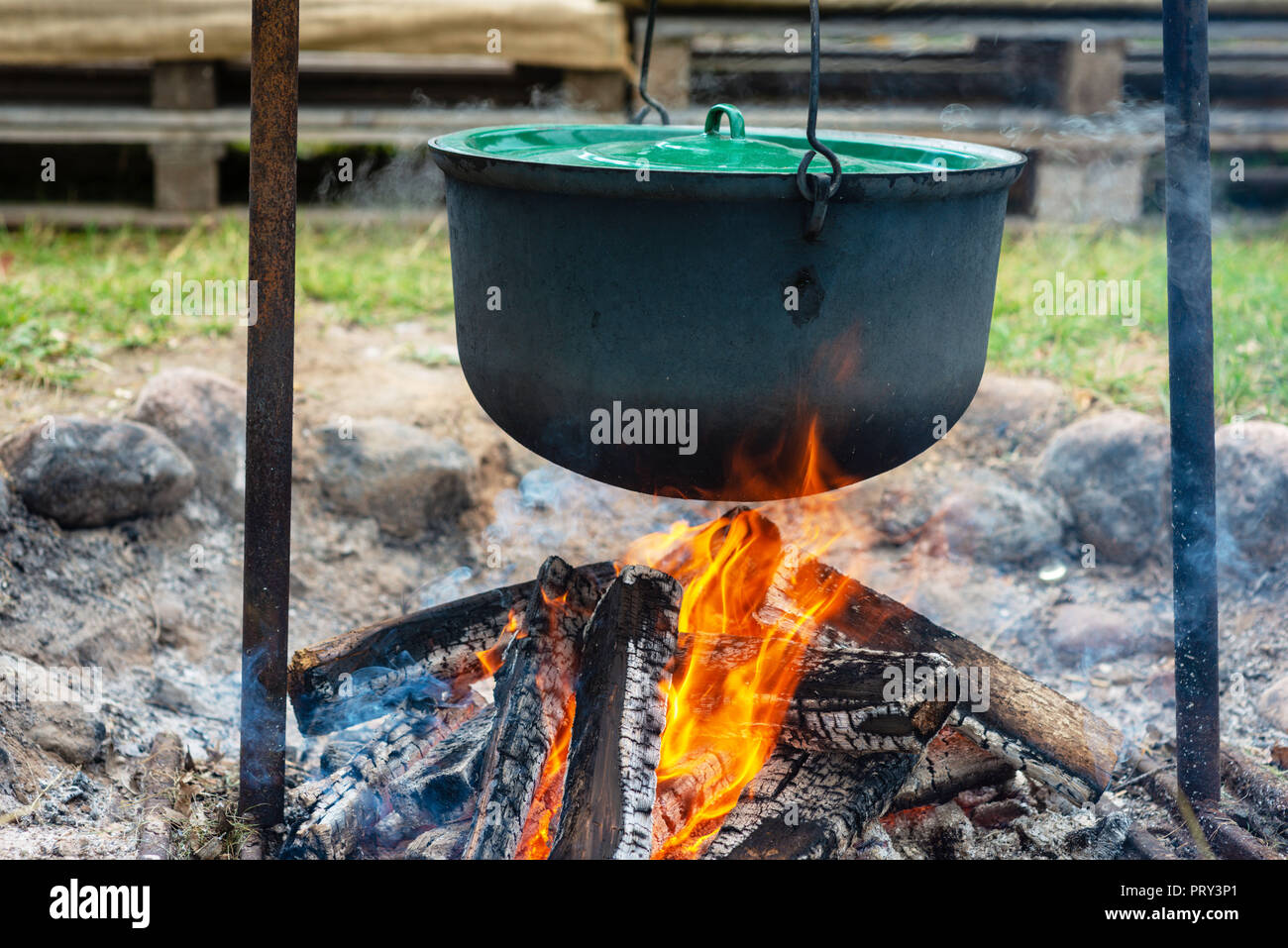 Pot hanging over camp fire hi-res stock photography and images - Alamy