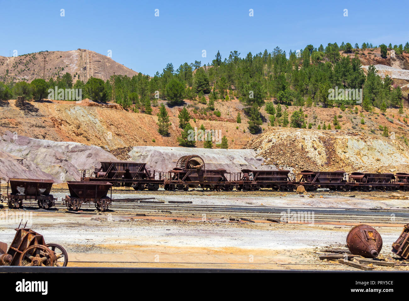 Old train wagon and rusty mining machines Stock Photo - Alamy