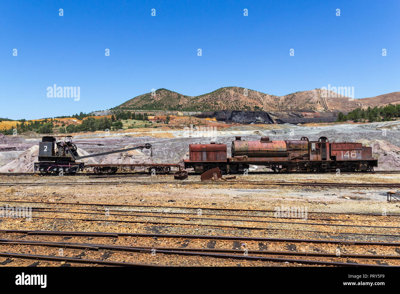 Old mining train with crane in centered view Stock Photo - Alamy