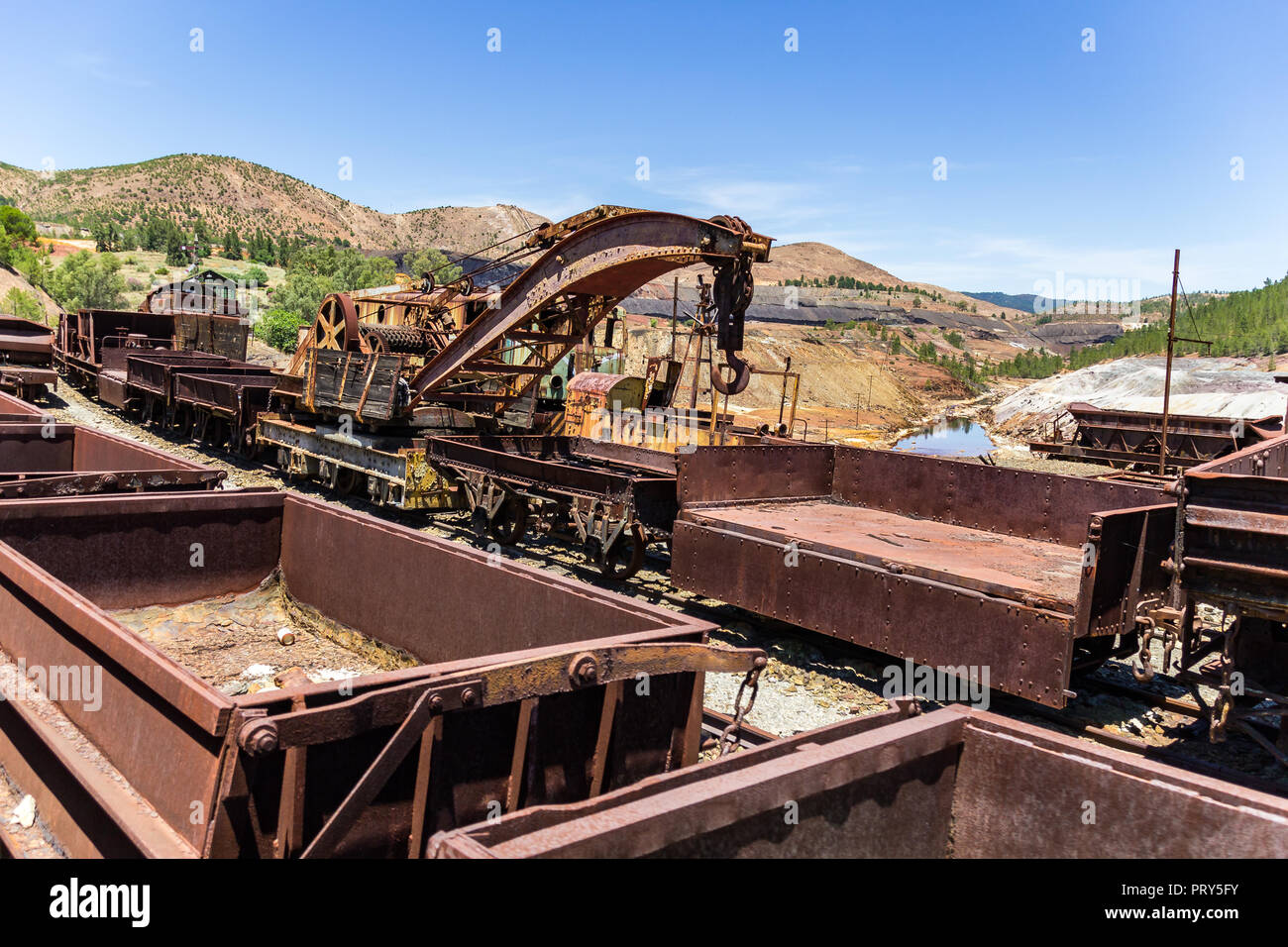 Near view of train mining wagon and crane Stock Photo - Alamy