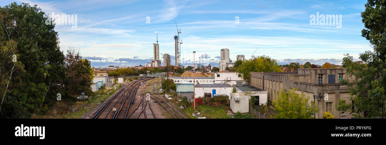 The changing skyline of Woking, Surrey: railway tracks lead into tower ...