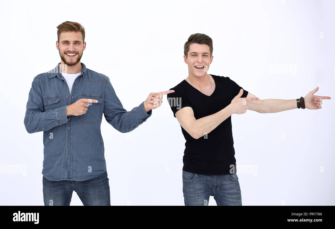 Standing young people pointing a finger in each hand Stock Photo - Alamy