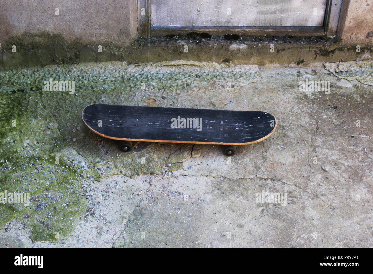 an old skate abandoned by someone near the basement porch Stock Photo ...