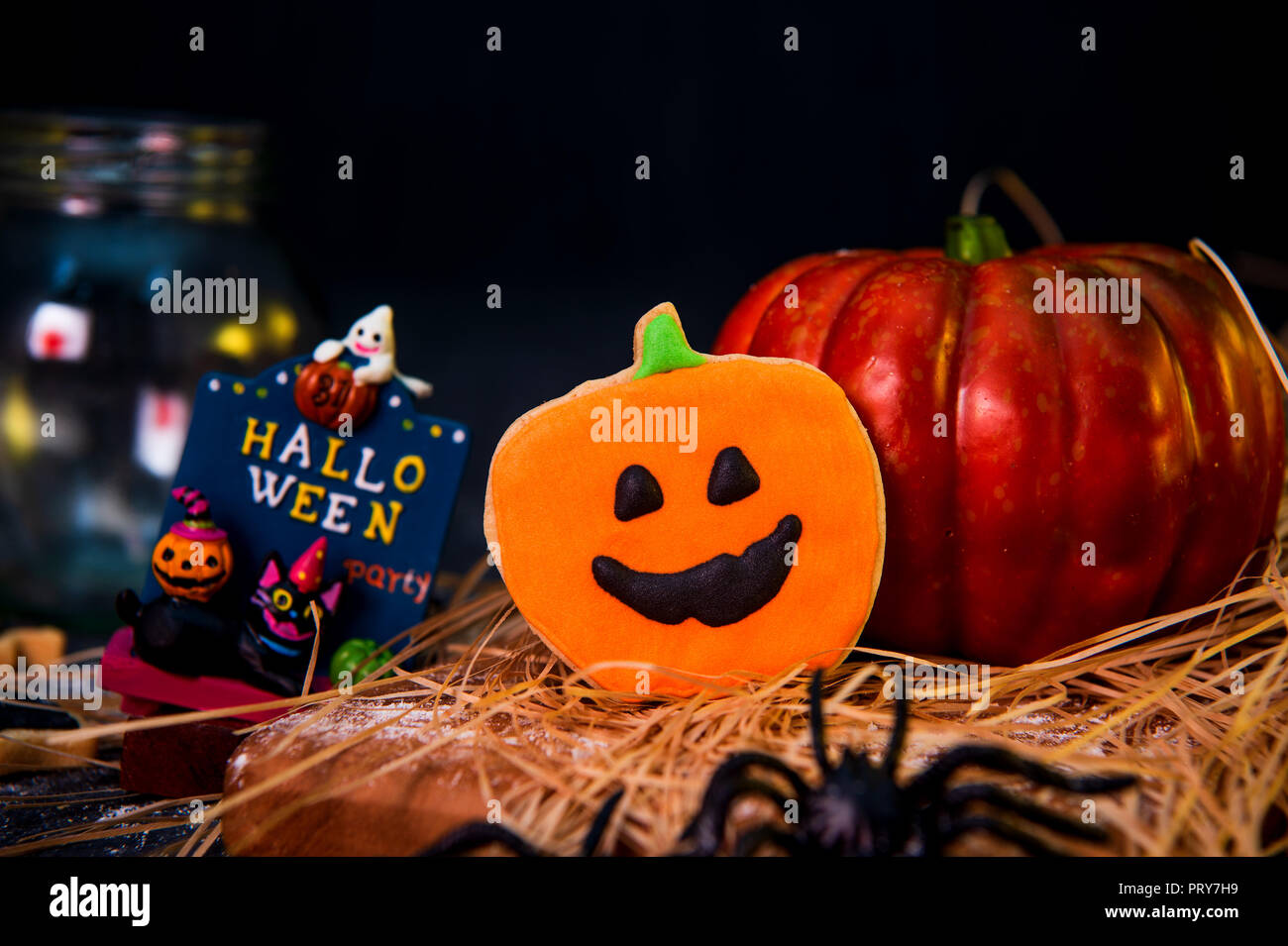 Fresh homemade decorated halloween cookies and sweets on dark ...