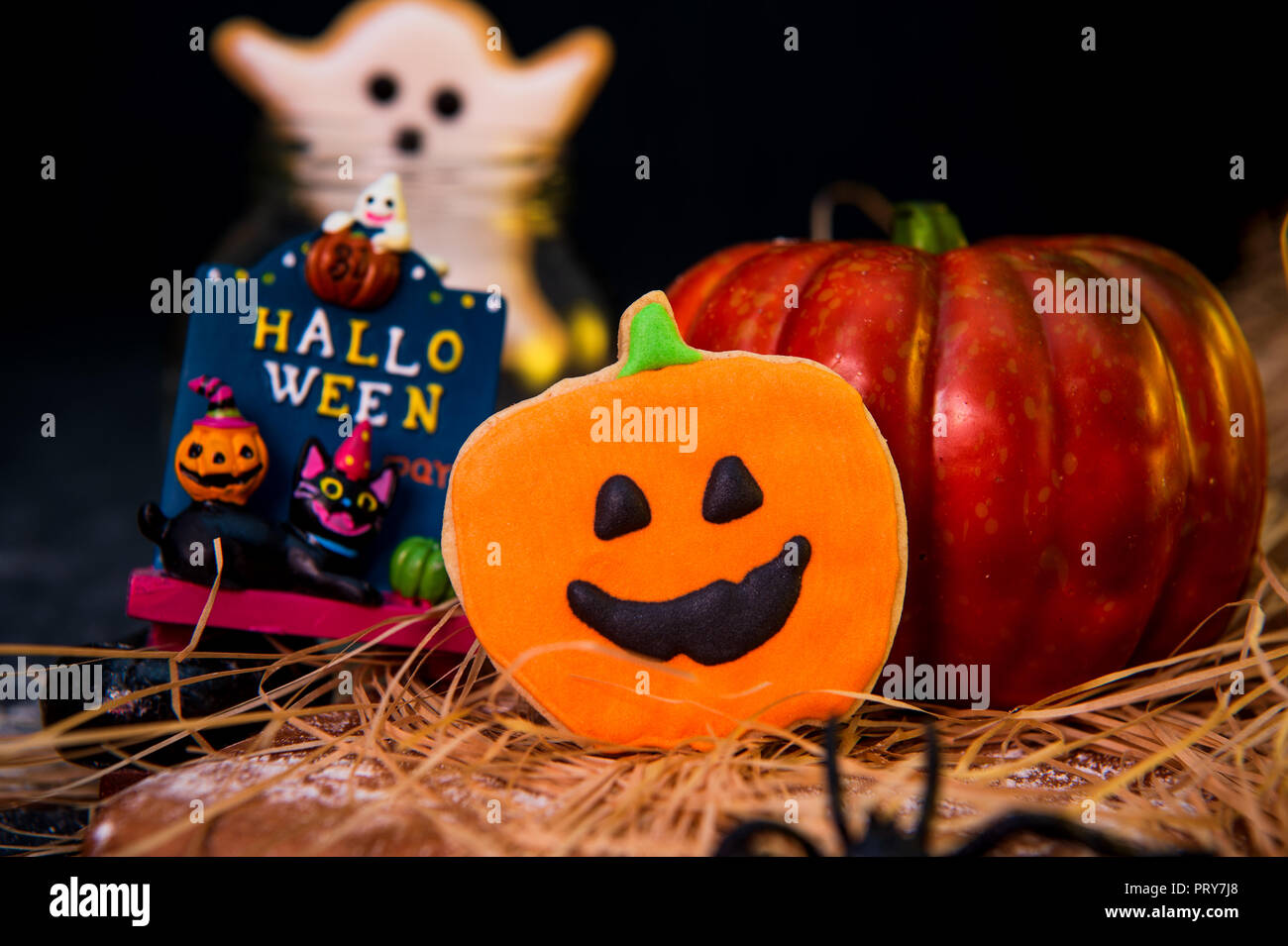 Fresh homemade decorated halloween cookies and sweets on dark ...