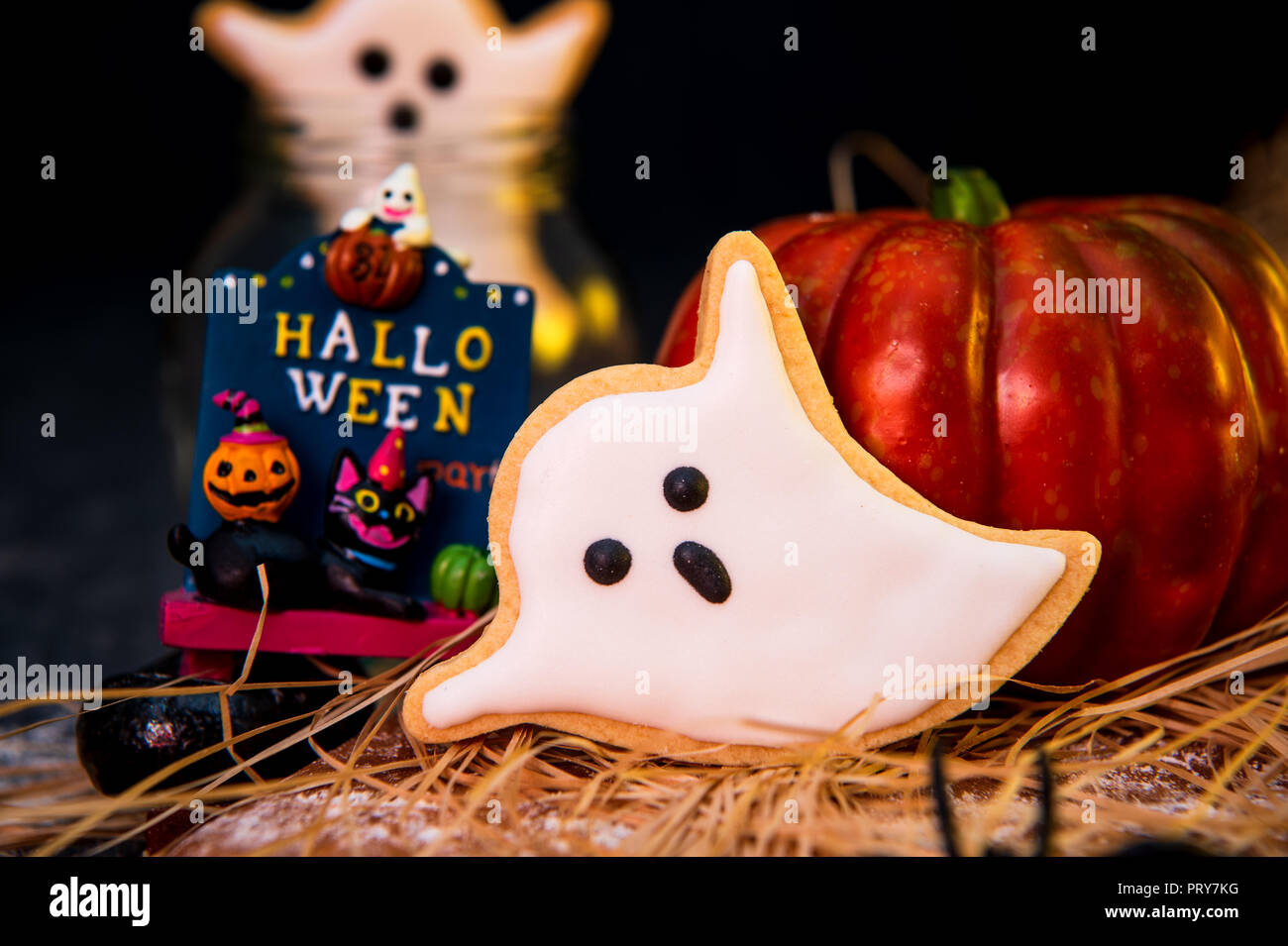 Fresh homemade decorated halloween cookies and sweets on dark ...