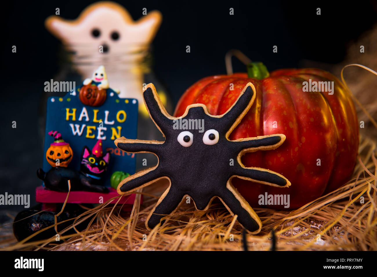 Fresh homemade decorated halloween cookies and sweets on dark ...