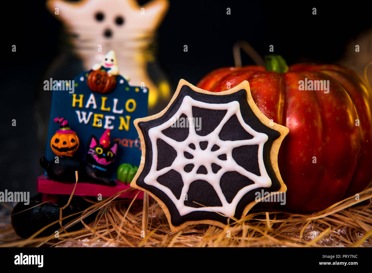 Fresh homemade decorated halloween cookies and sweets on dark ...