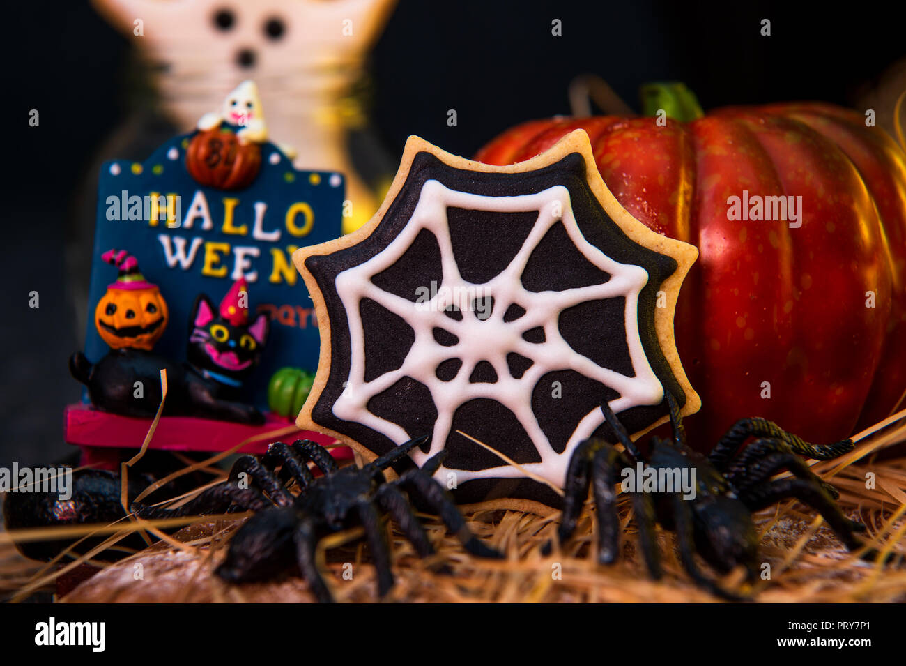 Fresh homemade decorated halloween cookies and sweets on dark ...