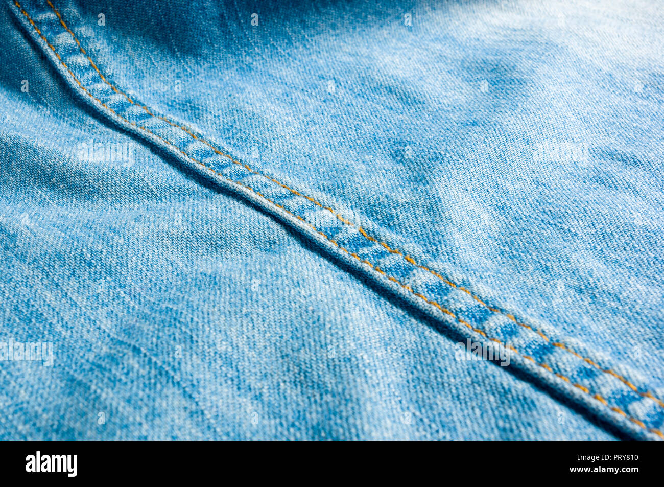 Blue washed faded jeans texture with seams, clothing items, macro ...