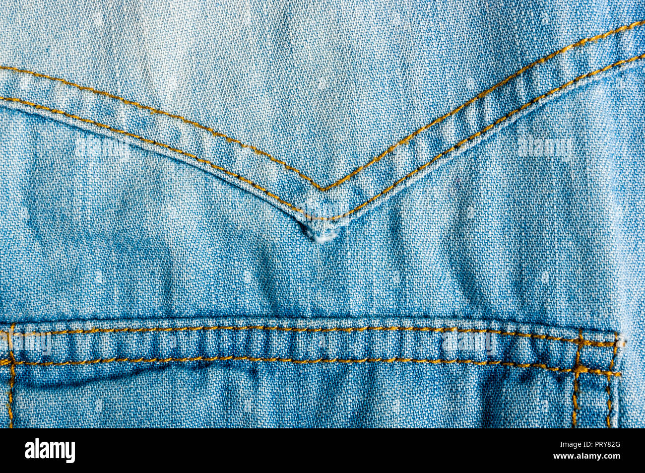 Blue washed faded jeans texture with seams, clothing items, macro ...