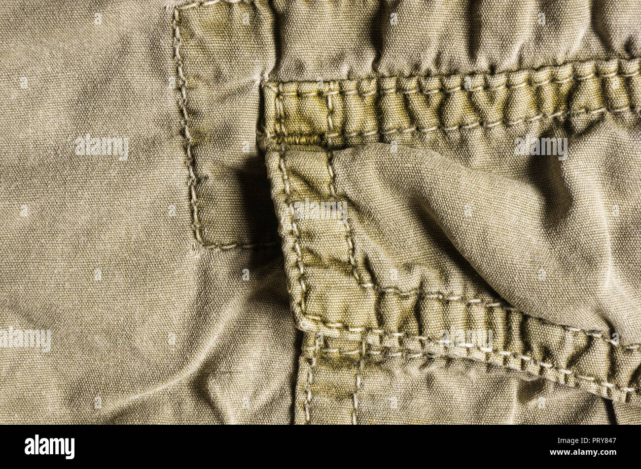 clothing items washed cotton fabric texture with seams, macro, close-up ...