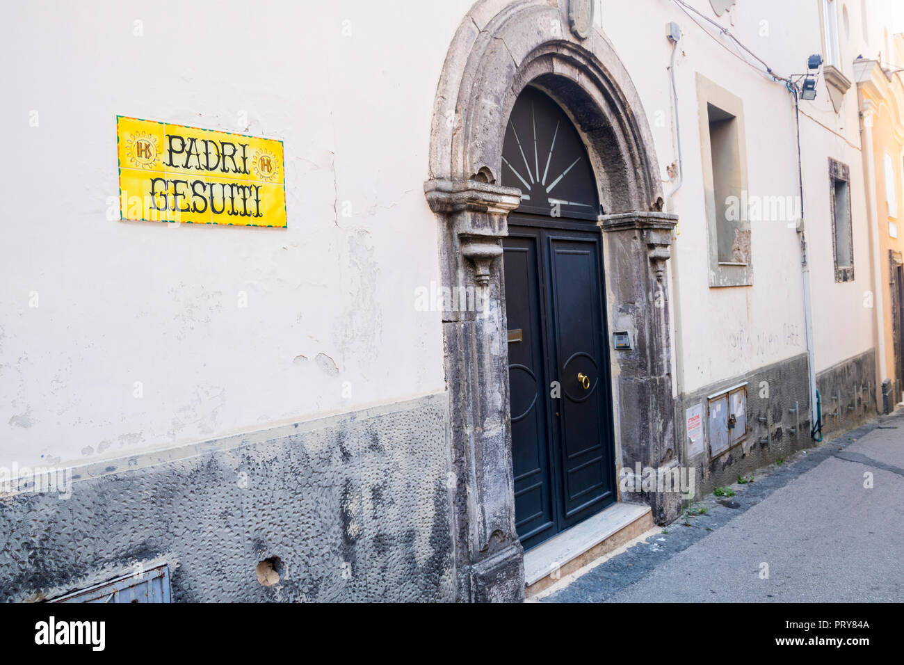 Old arch arched vintage ornate wooden panelled door, Vico Equense ...