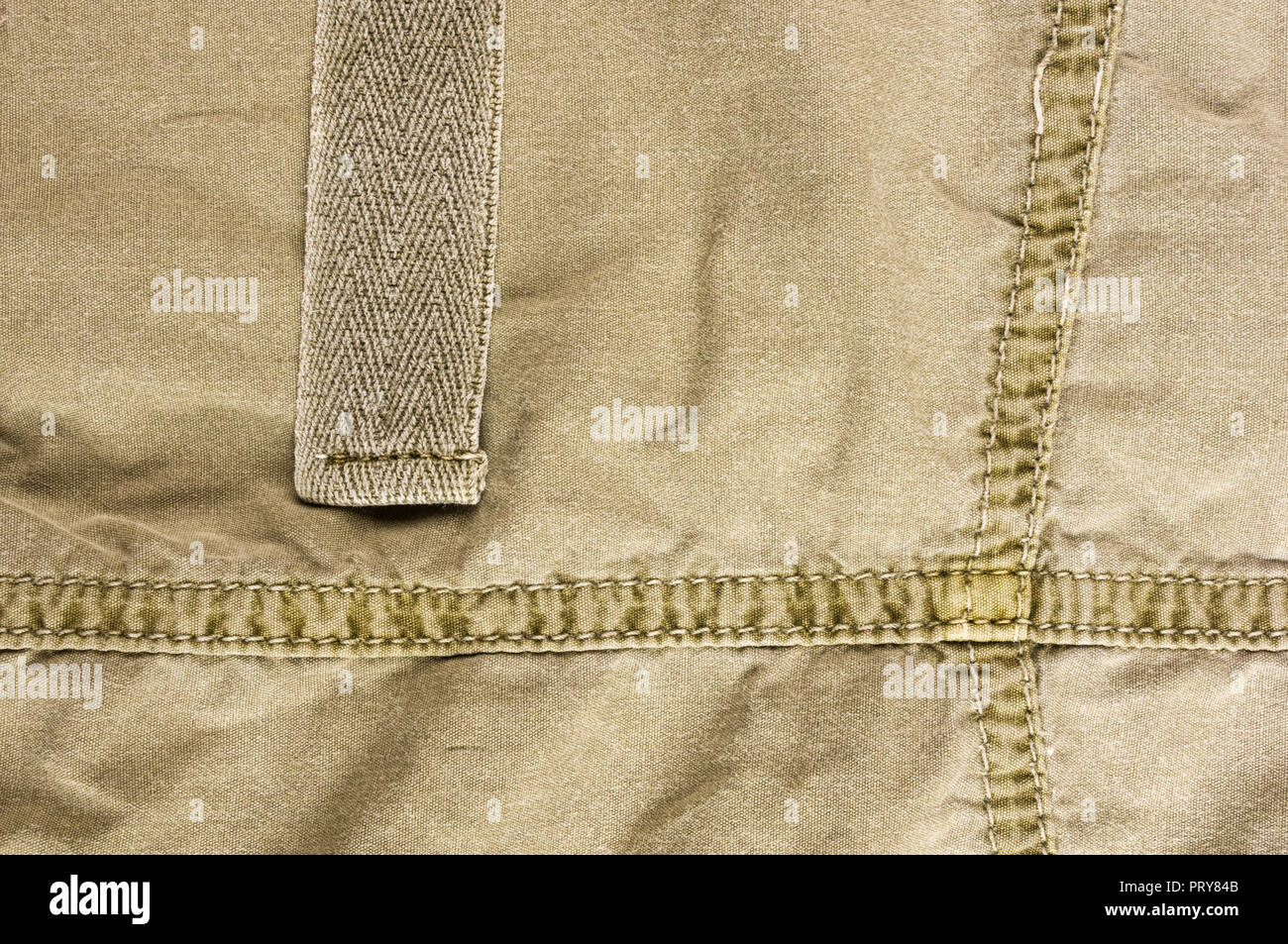 clothing items washed cotton fabric texture with seams, macro, close-up ...