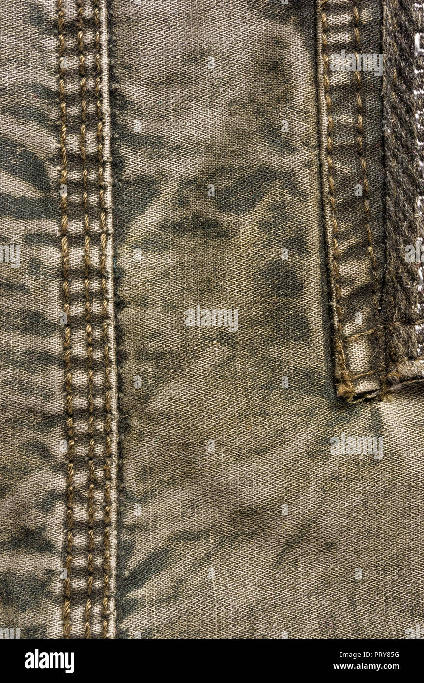clothing items washed cotton fabric texture with seams, macro, close-up ...