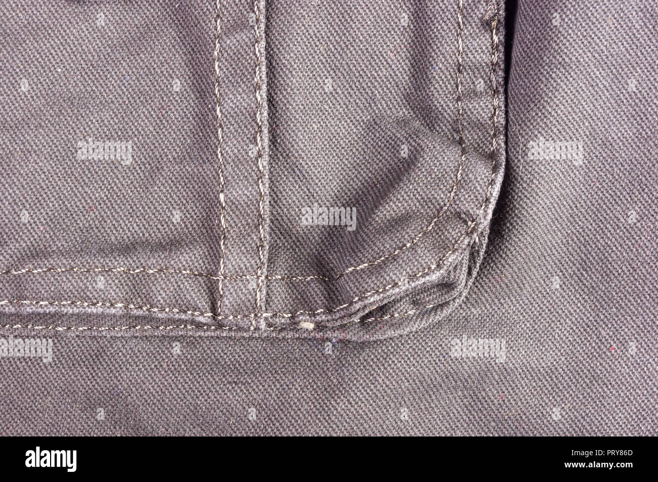 clothing items washed cotton fabric texture with seams, macro, close-up ...