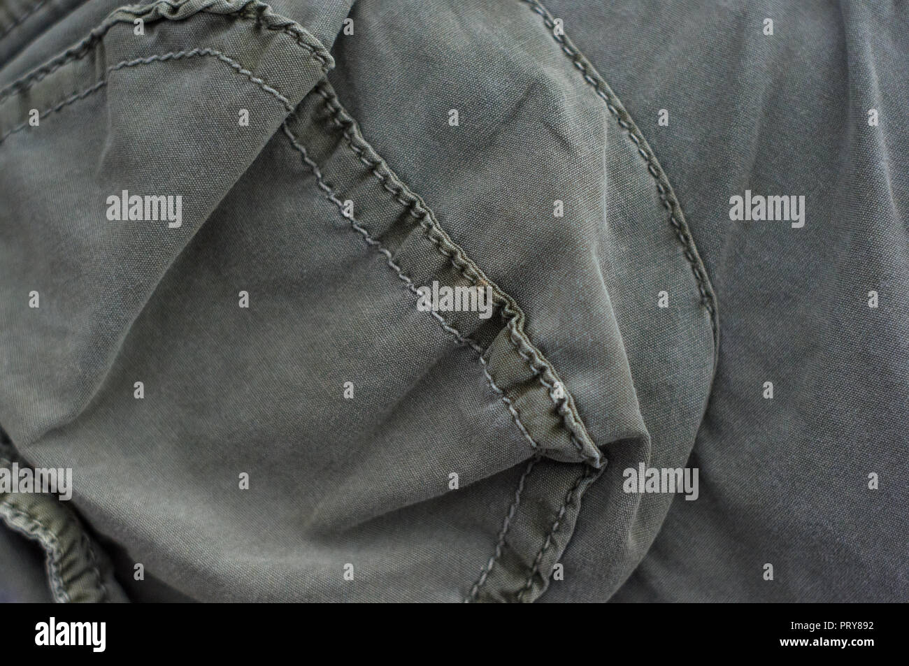 clothing items washed cotton fabric texture with seams, macro, close-up ...