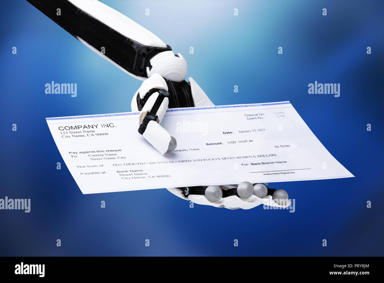 Robotic Hand Holding Cheque On Blue Background Stock Photo - Alamy