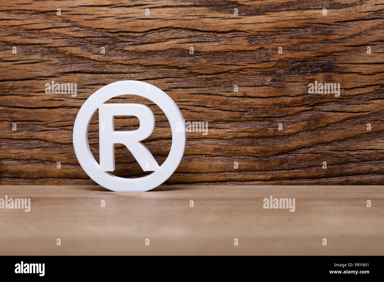 Registered Trademark Sign In Front Of Wooden Wall Stock Photo - Alamy