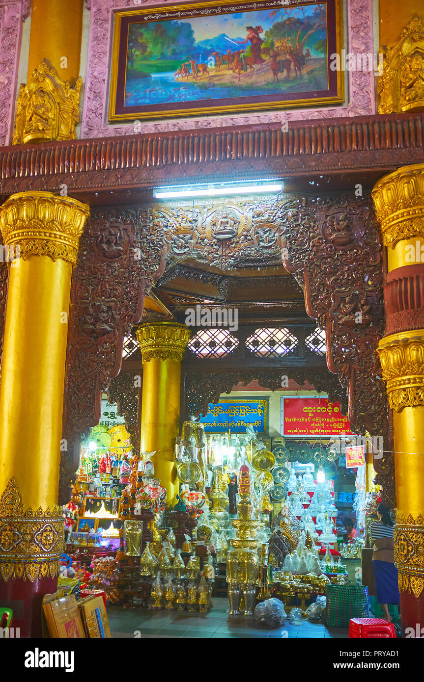 YANGON, MYANMAR - FEBRUARY 27, 2018: Different religious goods in ...