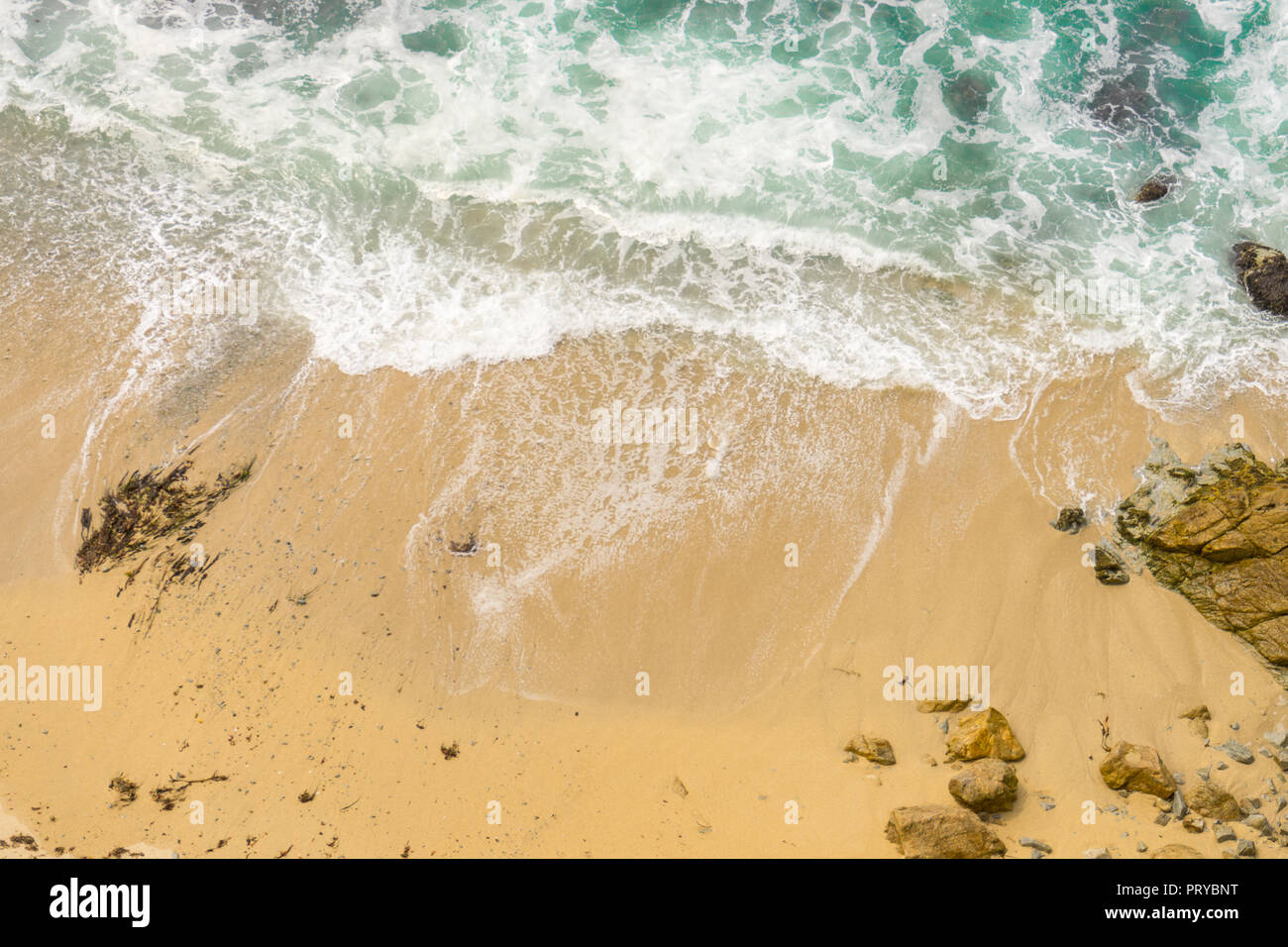 Ocean background with rock and sand from above. Aerial shot Stock Photo ...