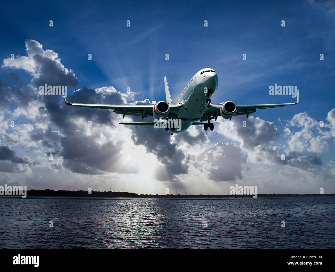 Colourful Australian Cloudscape Seascape with an airborne passenger jet ...